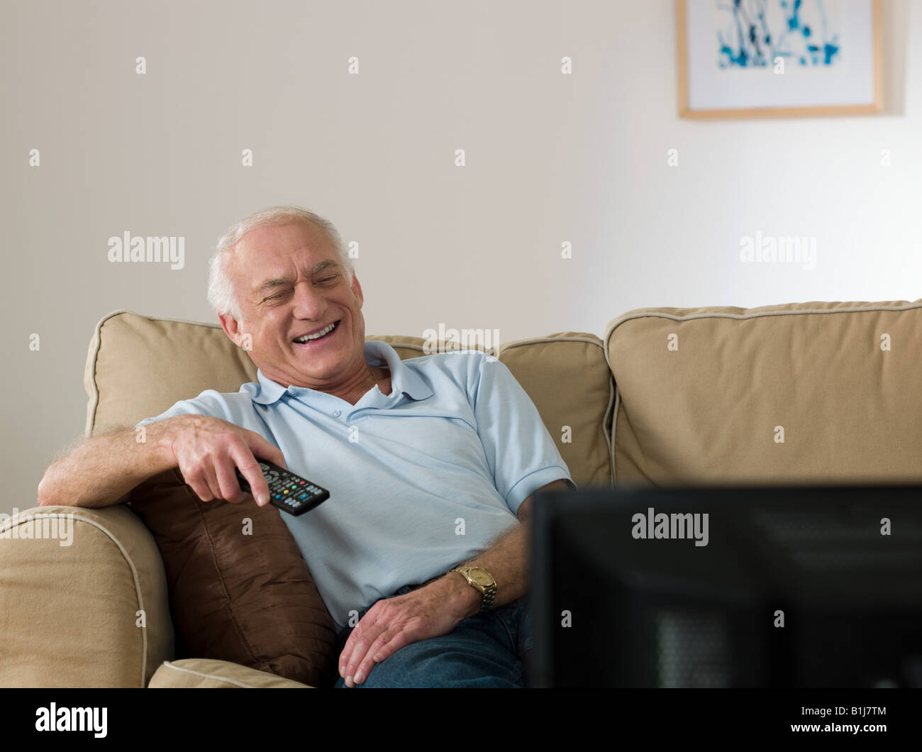 A senior man watching tv Stock Photo - Alamy