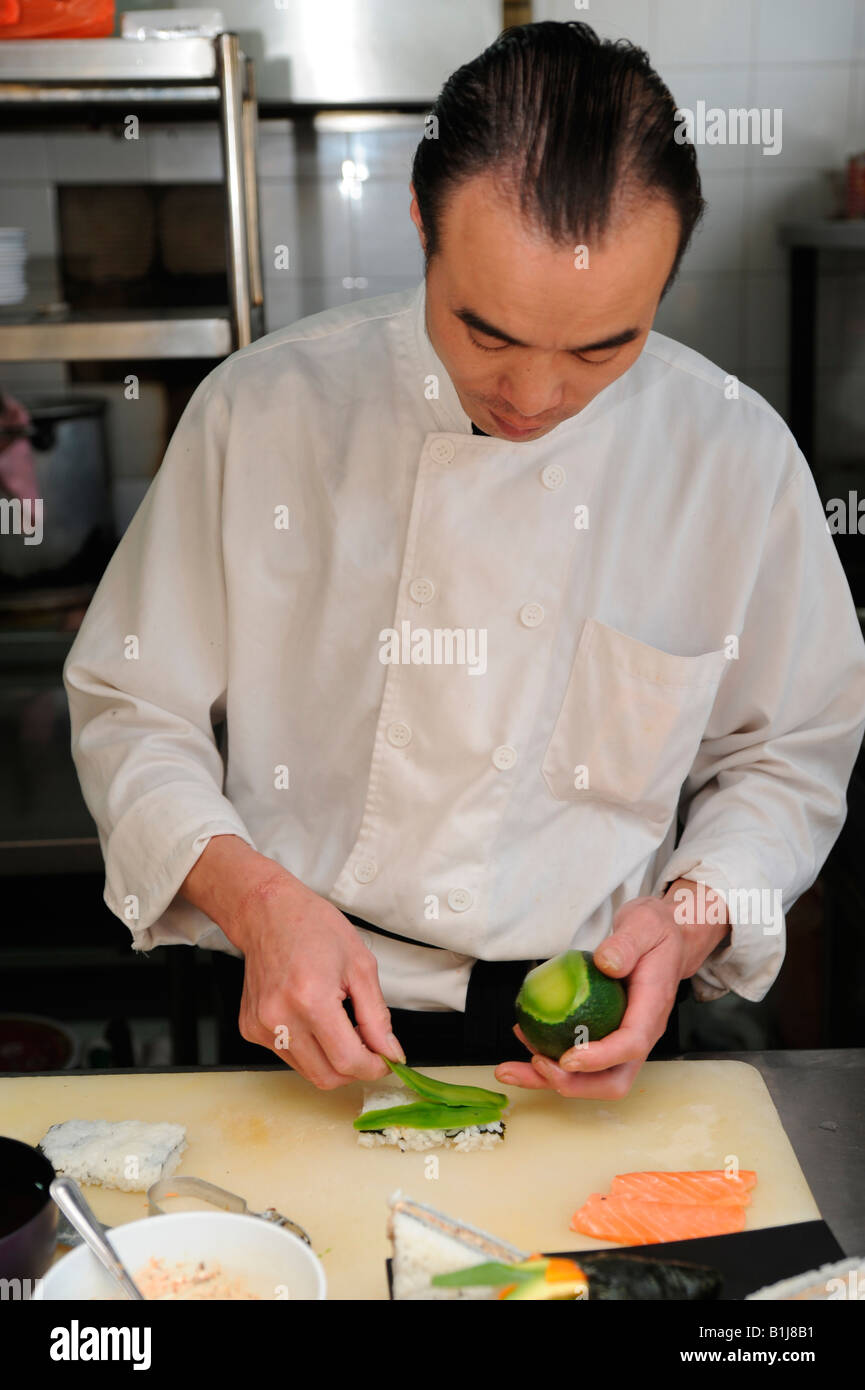 A Japanese cook preparing Sushi at a Japanese restaurant Stock Photo ...