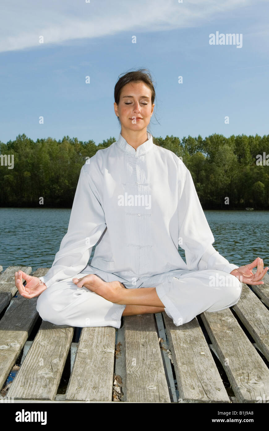 Yoga, half lotus pose, Ardha Padmasana, Mudra Stock Photo - Alamy