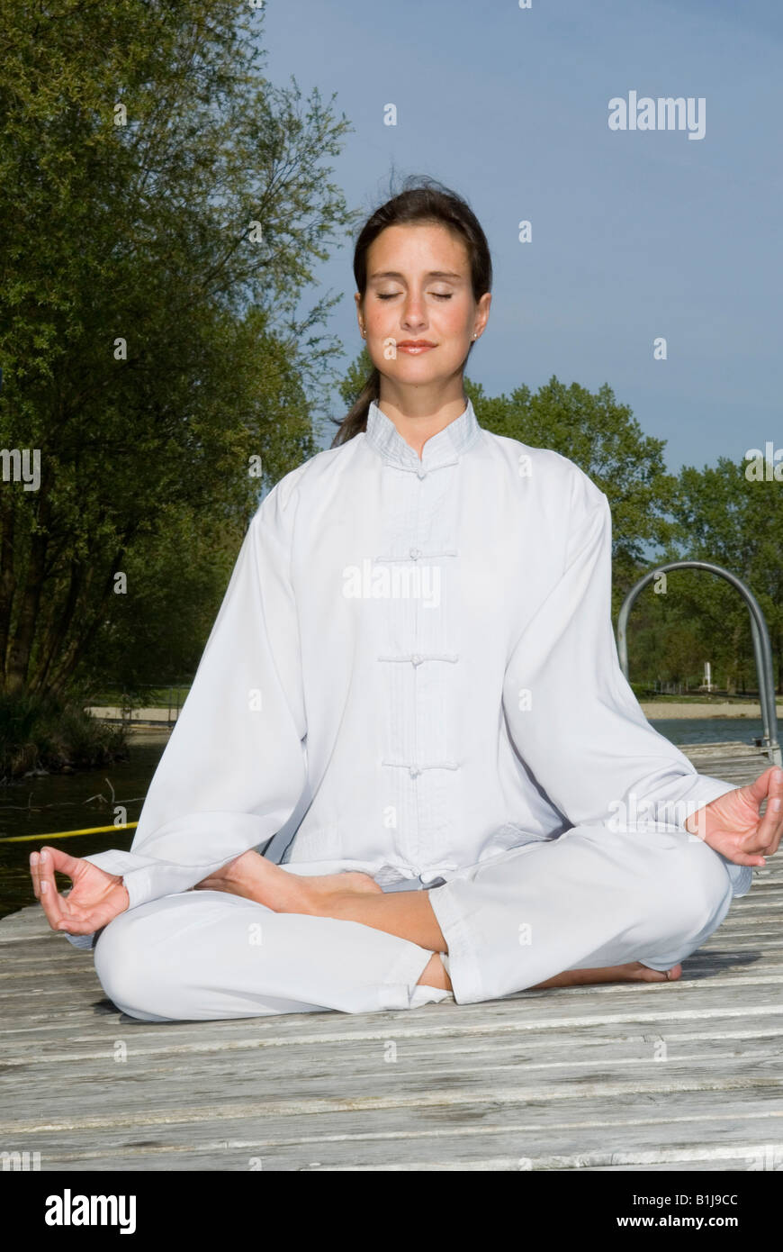 Yoga, half lotus pose, Ardha Padmasana, Mudra Stock Photo - Alamy