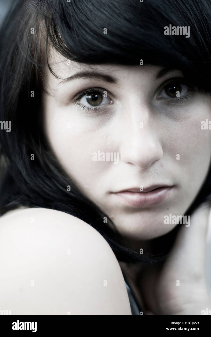seriously looking young woman Stock Photo - Alamy