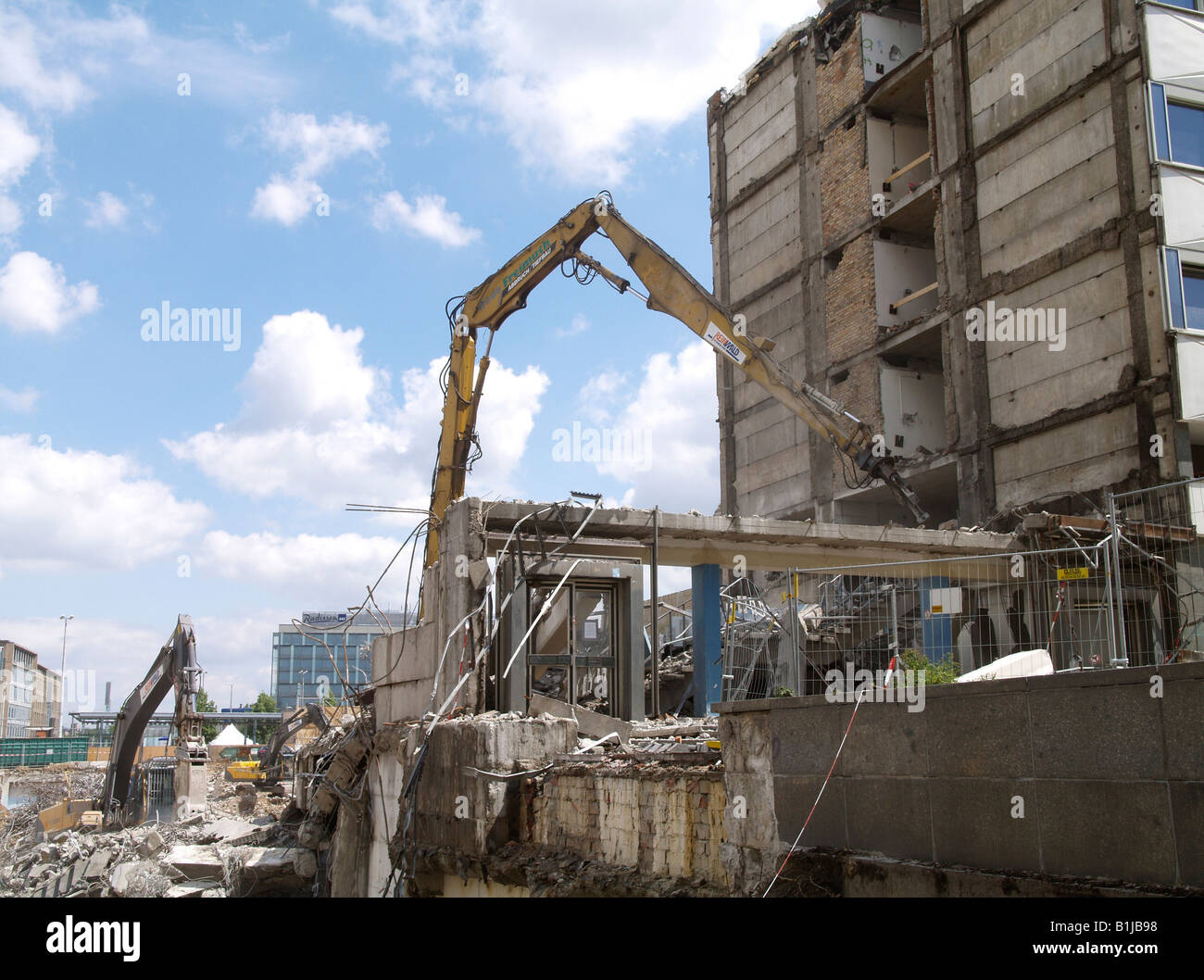 cranes and excavators at a construction site. Demolition of old houses ...