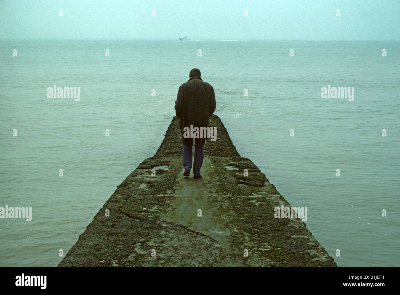 male walking into sea Stock Photo - Alamy