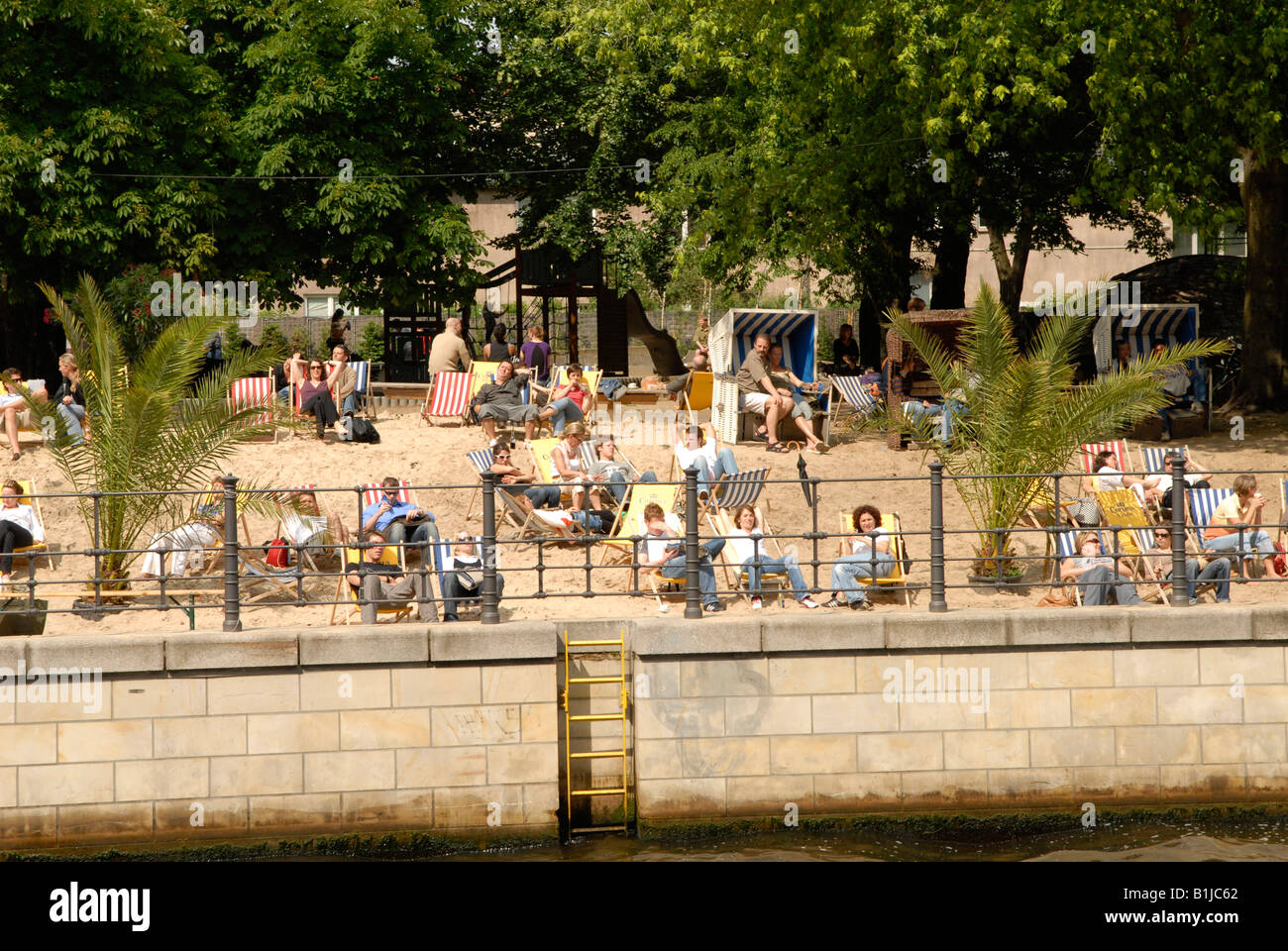 sandy beach with deck chairs at the Spree, Germany, Berlin Stock Photo ...