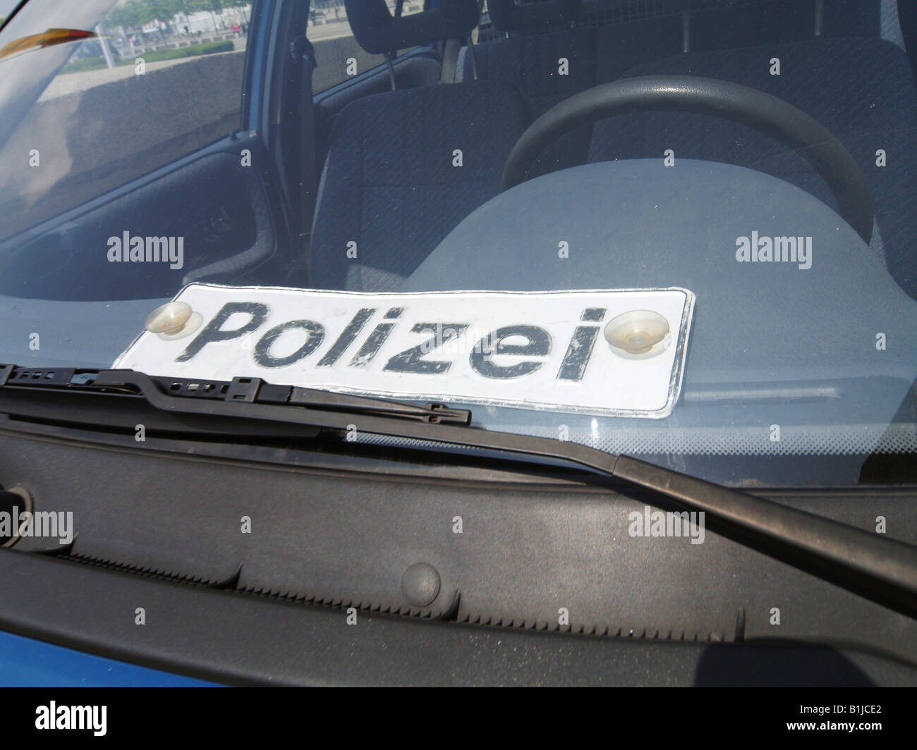 police sign behind windshield Stock Photo - Alamy