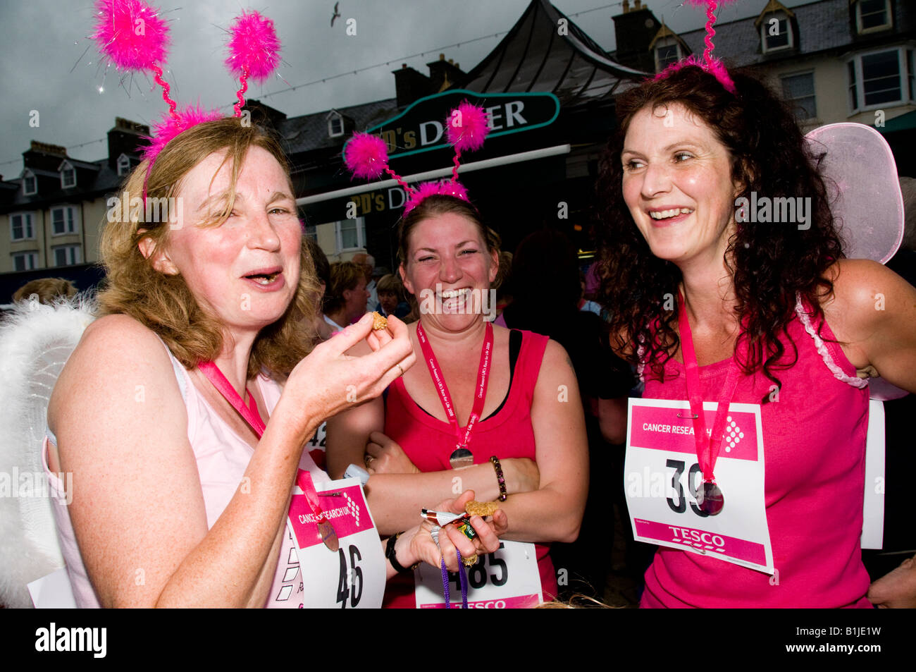 Three women after running the Race for Life sponsored charity women s ...