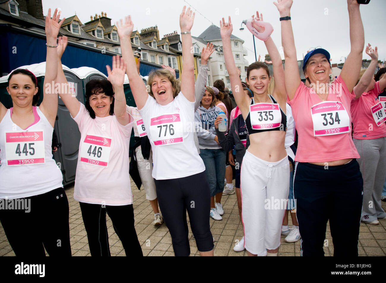 group of women warming up before the Race for Life sponsored charity ...