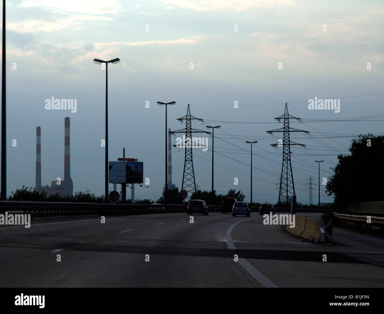 power plant and power poles at a highway Stock Photo - Alamy