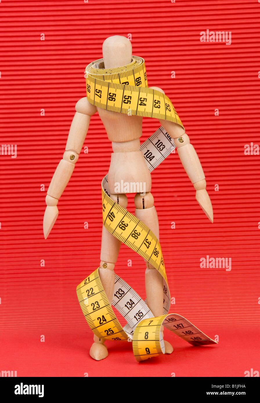 jointed doll wound in a measuring tape Stock Photo - Alamy