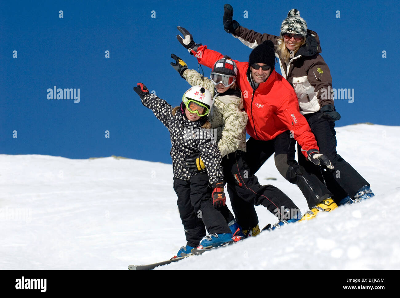 skiing family in winter holiday, France, Alps Stock Photo - Alamy