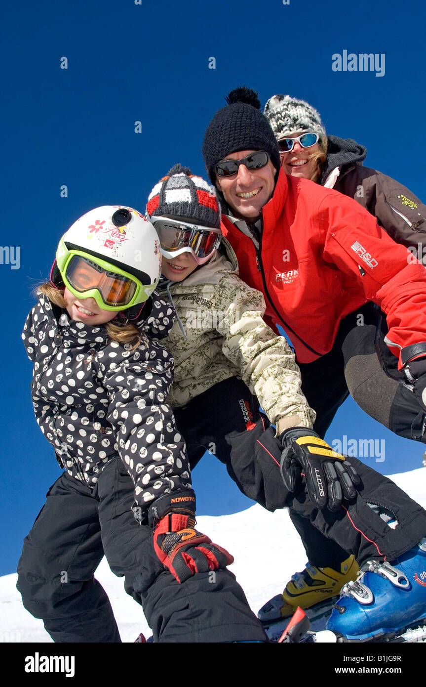 skiing family in winter holiday, France, Alps Stock Photo - Alamy