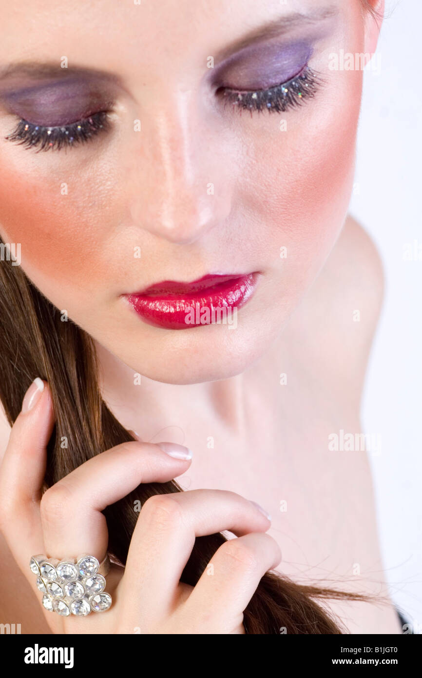 young rouged woman with violett eye shadow and red lips Stock Photo - Alamy