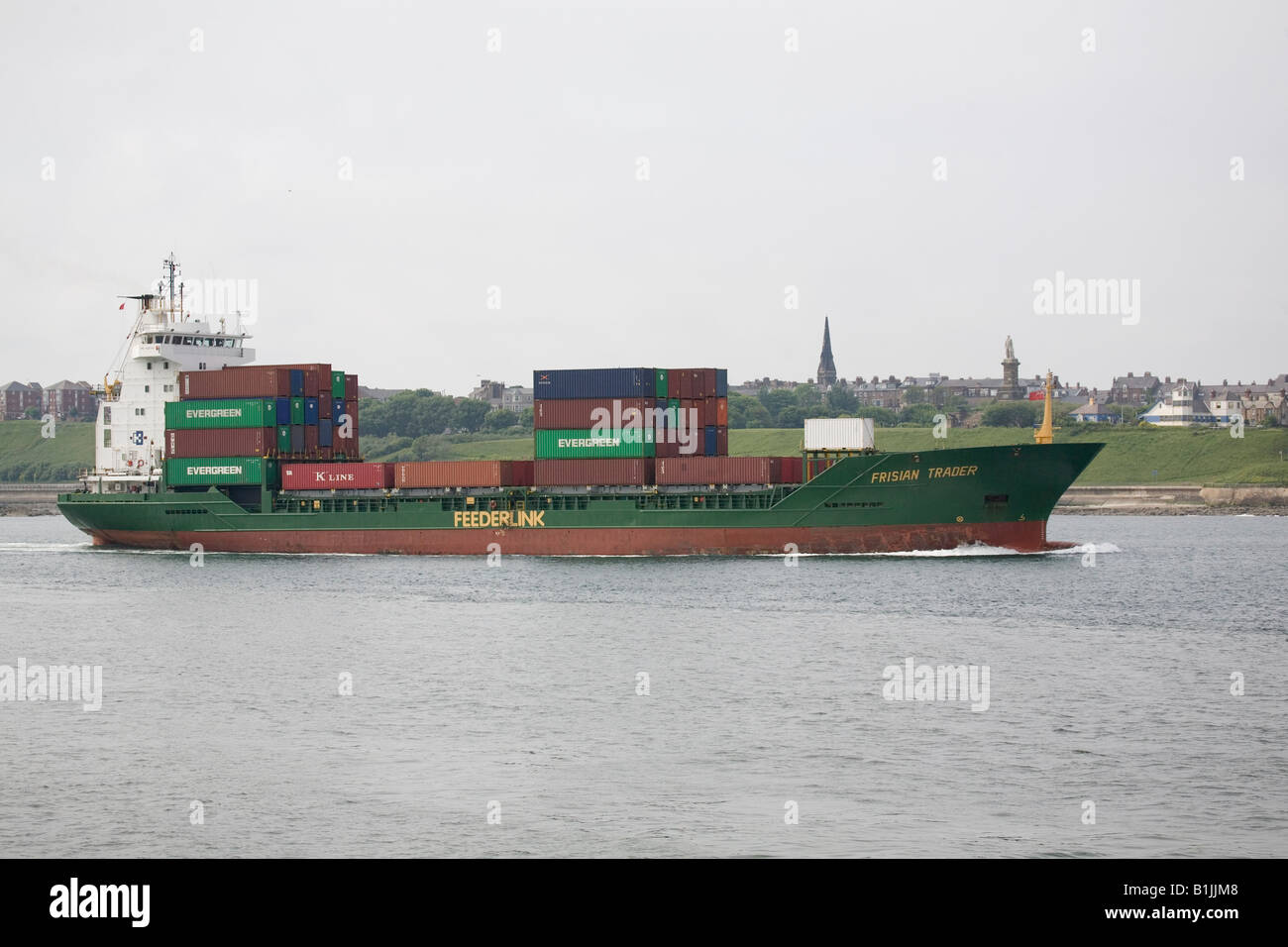 A frighter leaves the river Tyne, as seen from South Shields in England ...