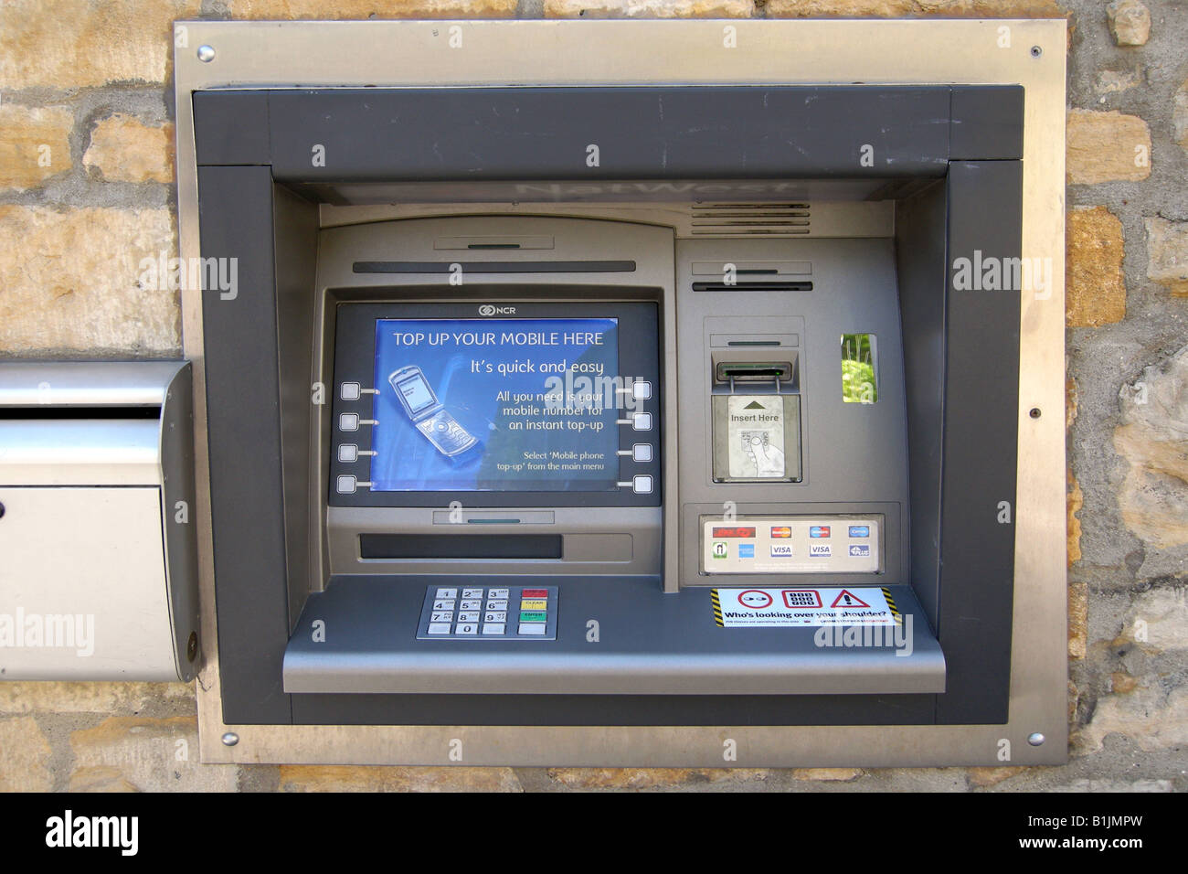 An ATM hole in the wall cash machine Stock Photo - Alamy