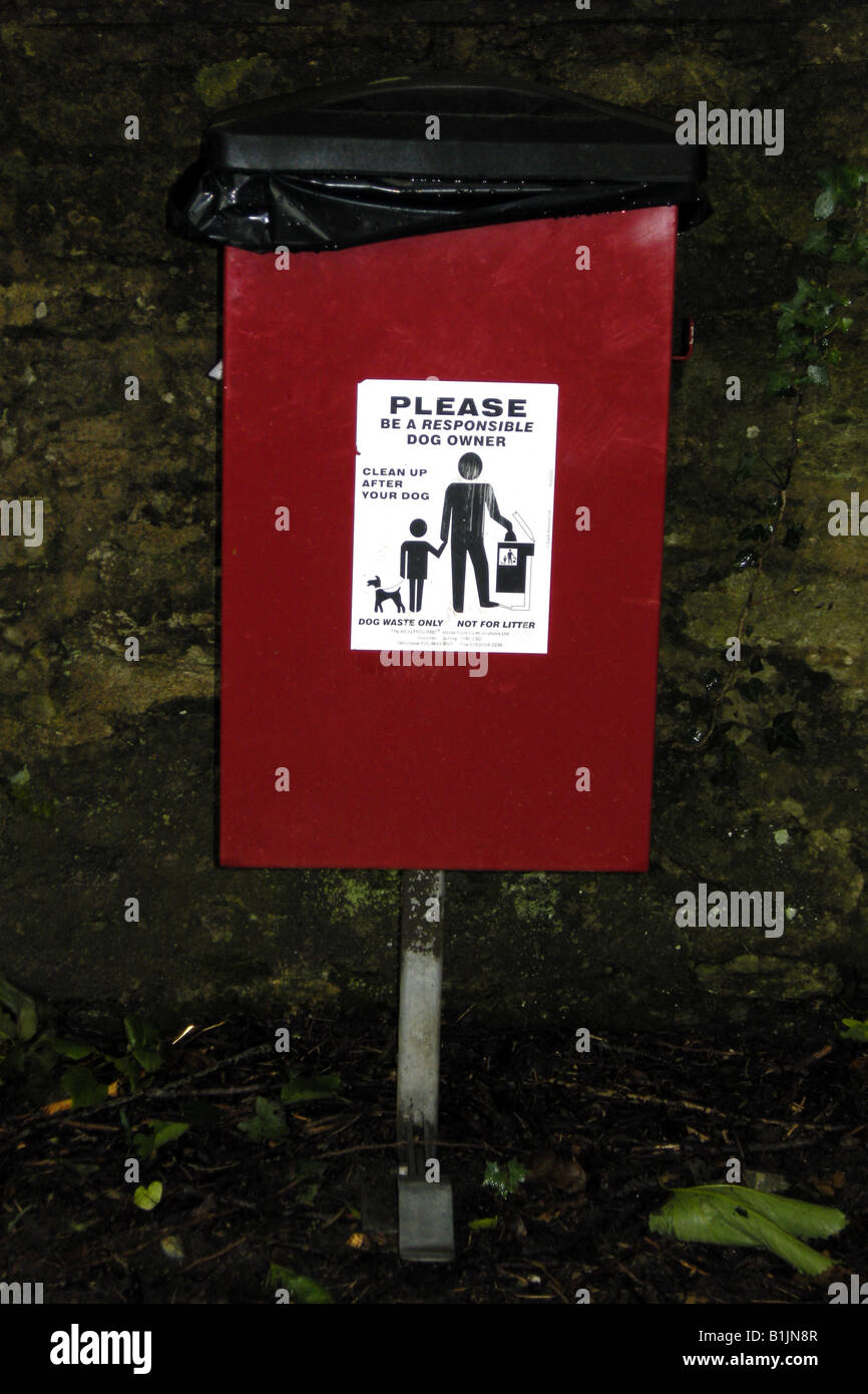 Sign on a dog loo dustbin asking people to be responsible for their pet ...