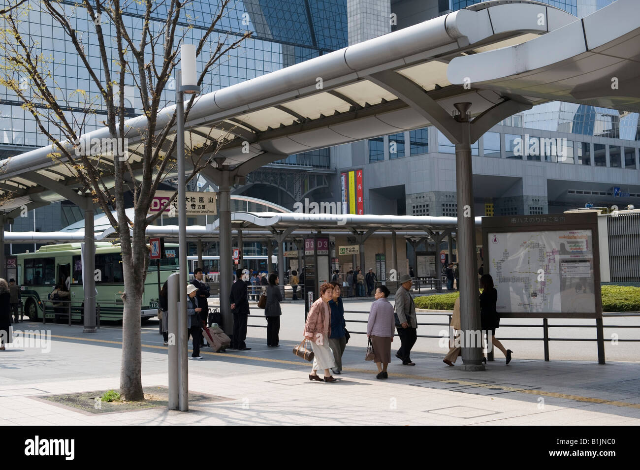 Kyoto, Japan. The busy central bus station, outside the main railway ...