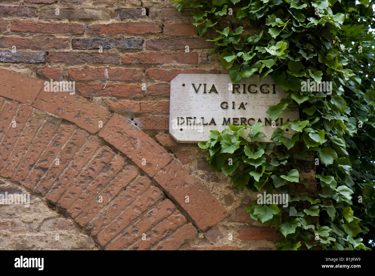 overgrown street sign Stock Photo - Alamy