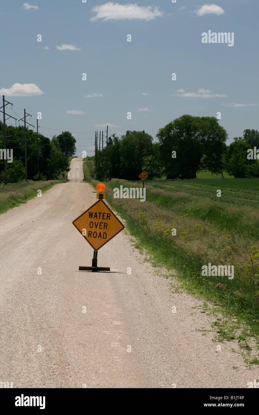 Flood warning sign on country road Stock Photo - Alamy
