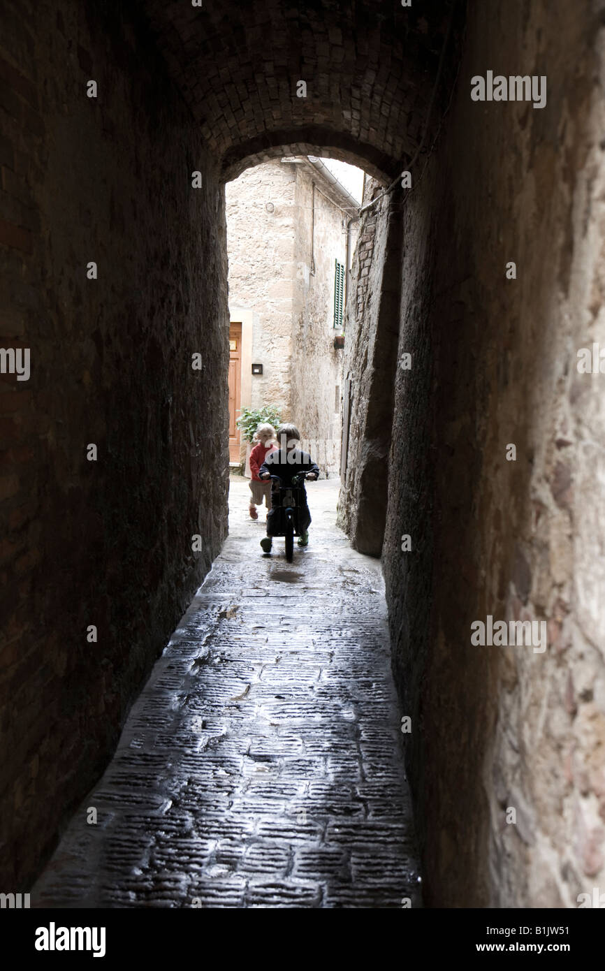 children playing in narrow street Stock Photo - Alamy