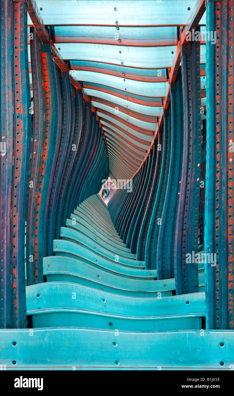 Geometrical steel beams form a twisted tunnel leading to an eye using ...