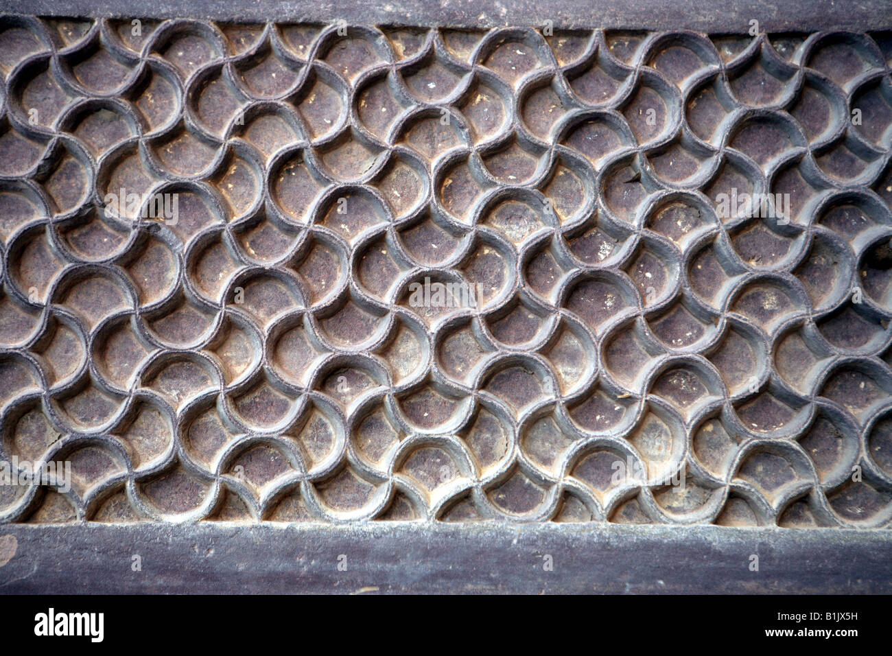 Patterns carved in the stone walls of Jahangir Mahal or palace Orchha ...