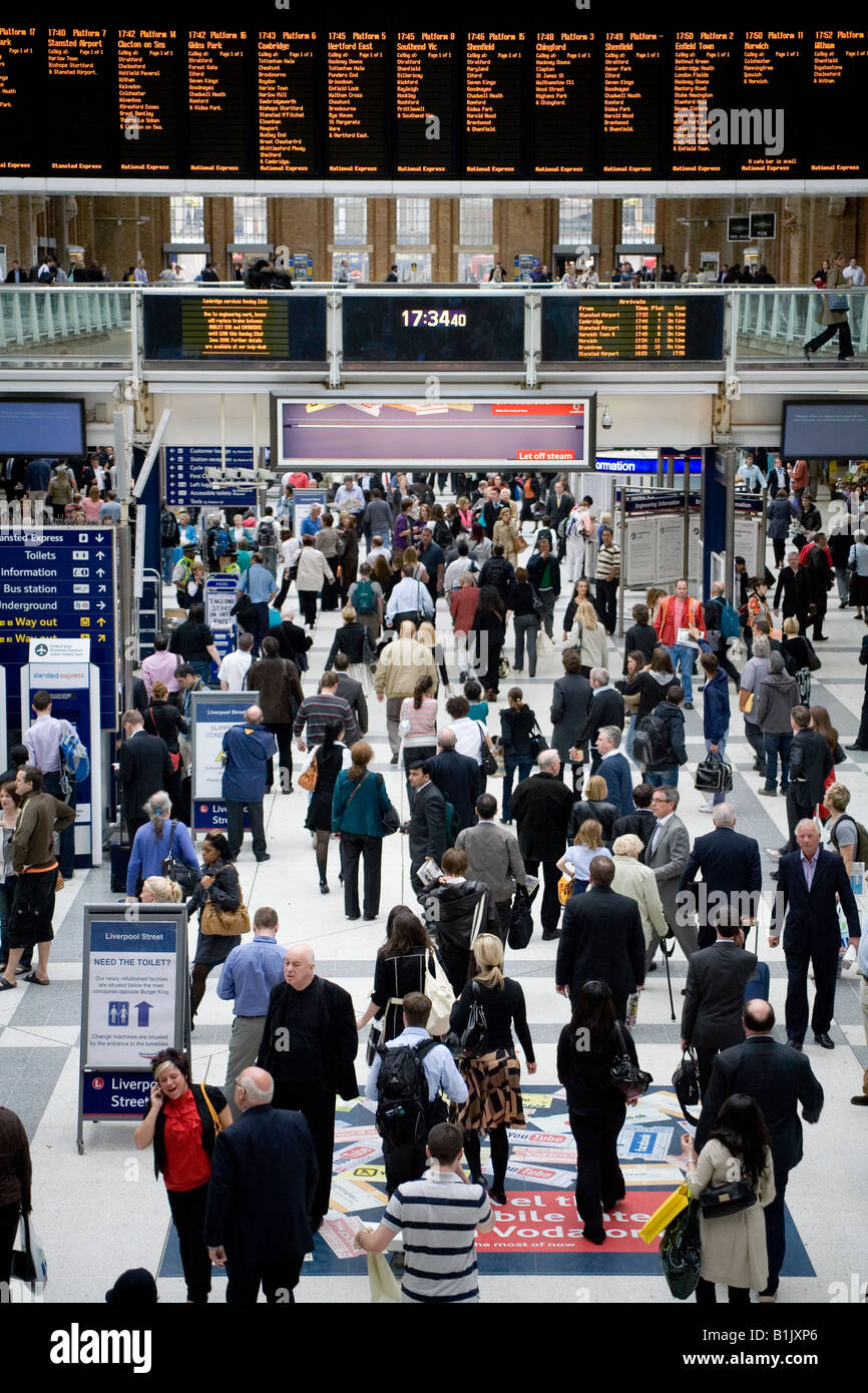 Passengers browsing trough Liverpool street station London England ...