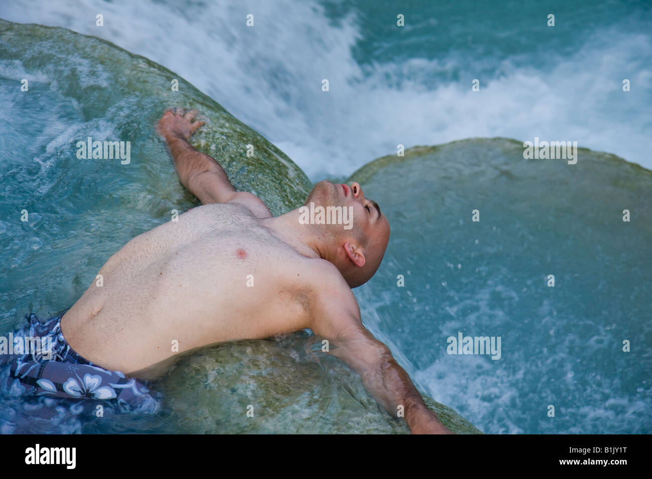 man enjoying the refreshing water Stock Photo - Alamy
