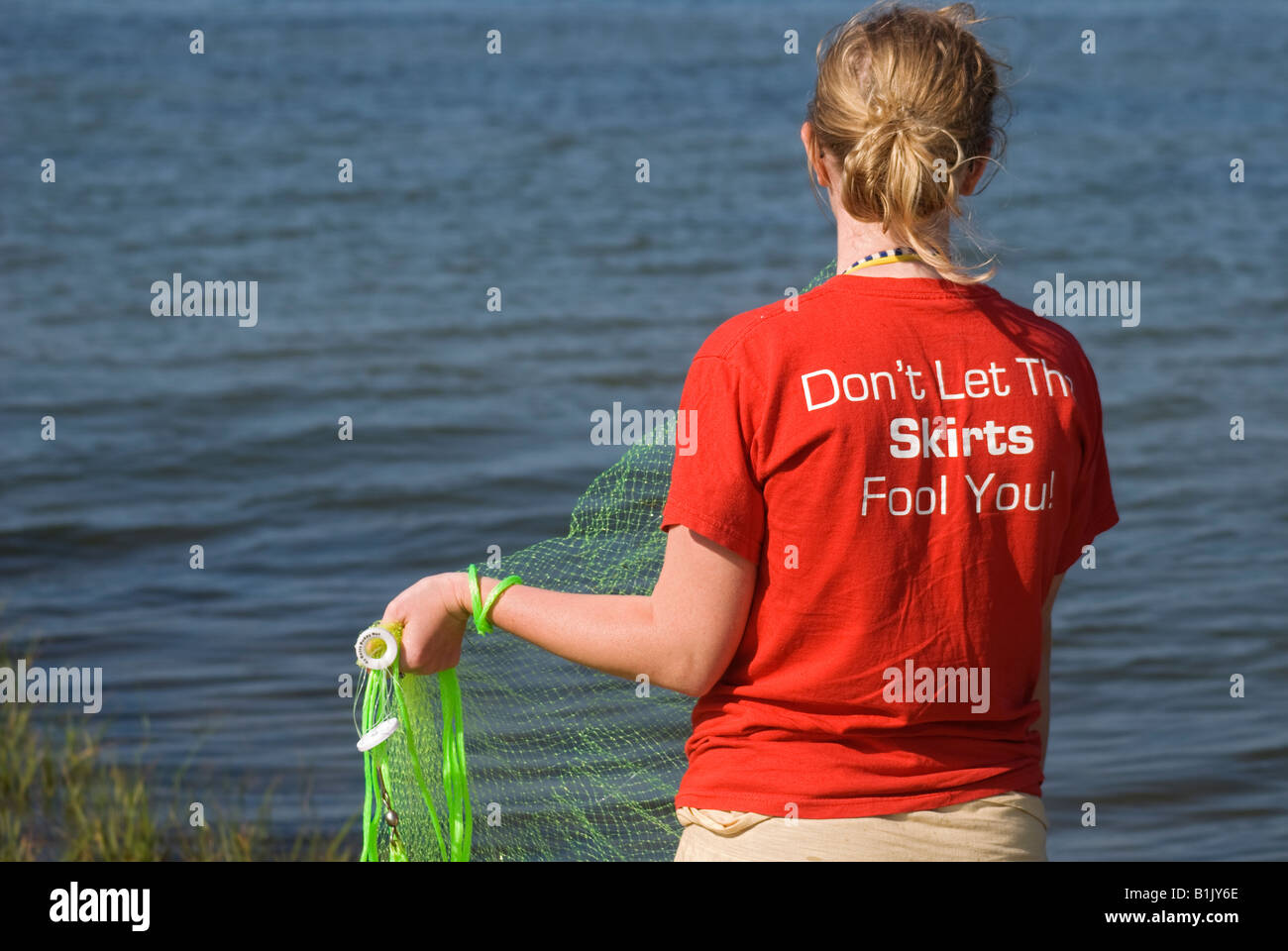 woman prepares to cast a net for fish, North Florida Stock Photo - Alamy