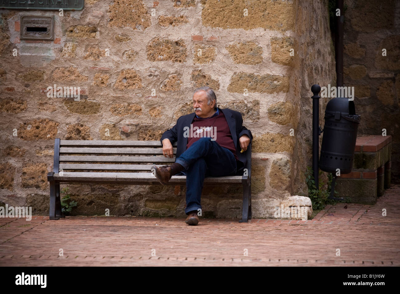 lonely man sitting on bench Stock Photo - Alamy