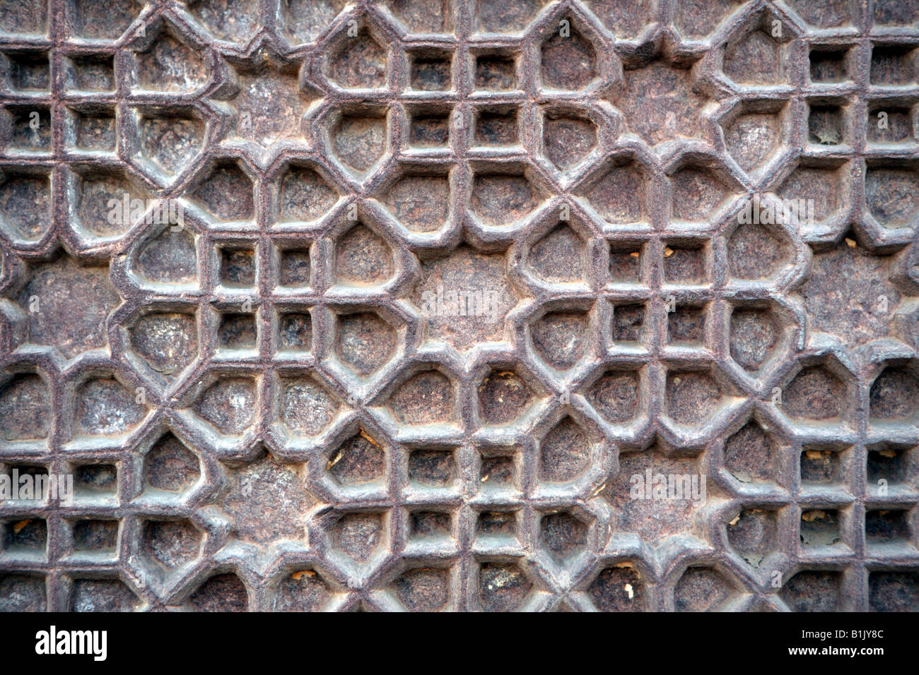 Patterns carved in the stone walls of Jahangir Mahal or palace Orchha ...