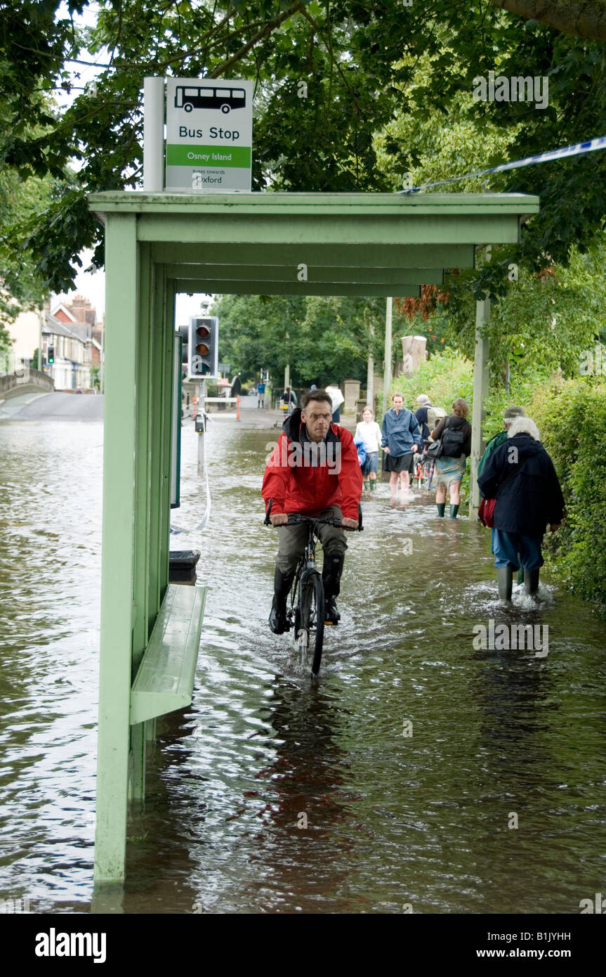 Determined People Continue about their Day as Flood Water Rise on Osney ...