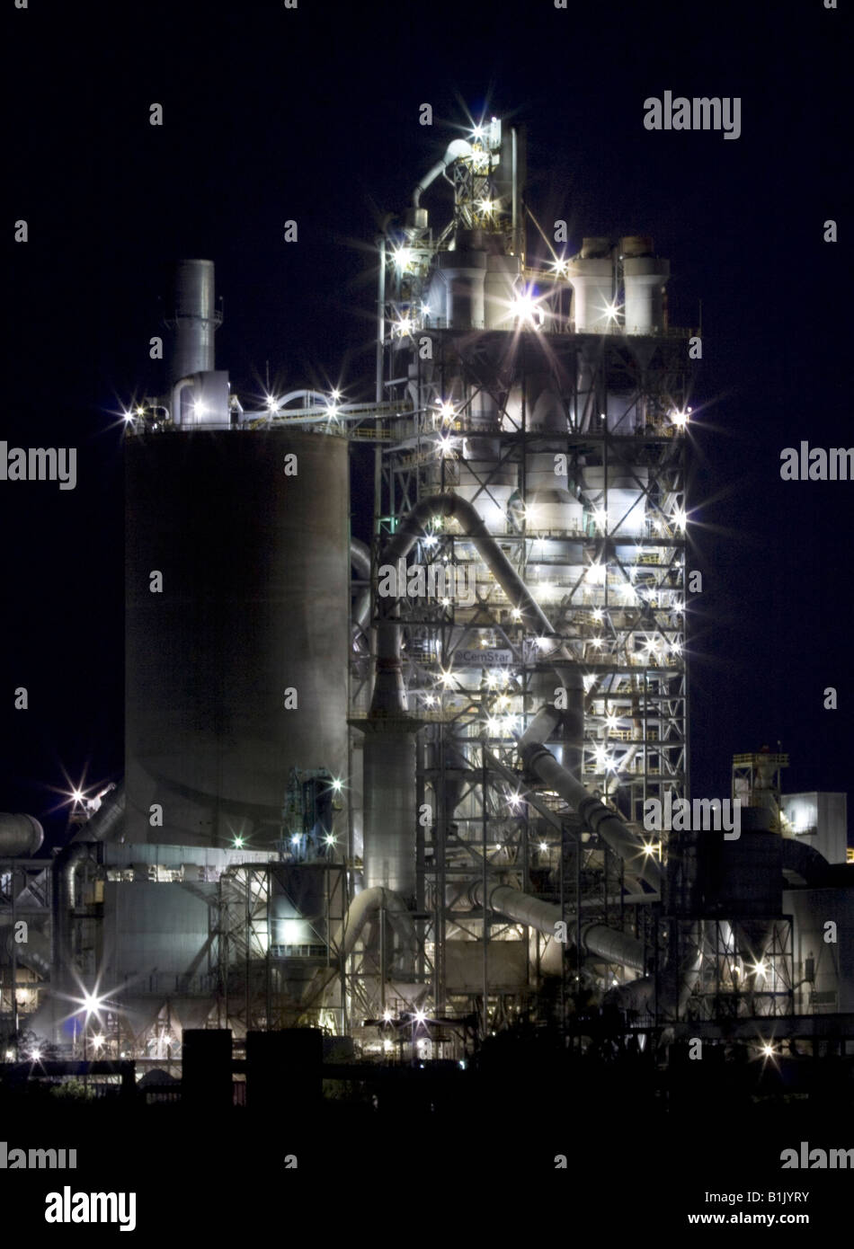 A cement factory in North Texas photographed at night with its lights ...