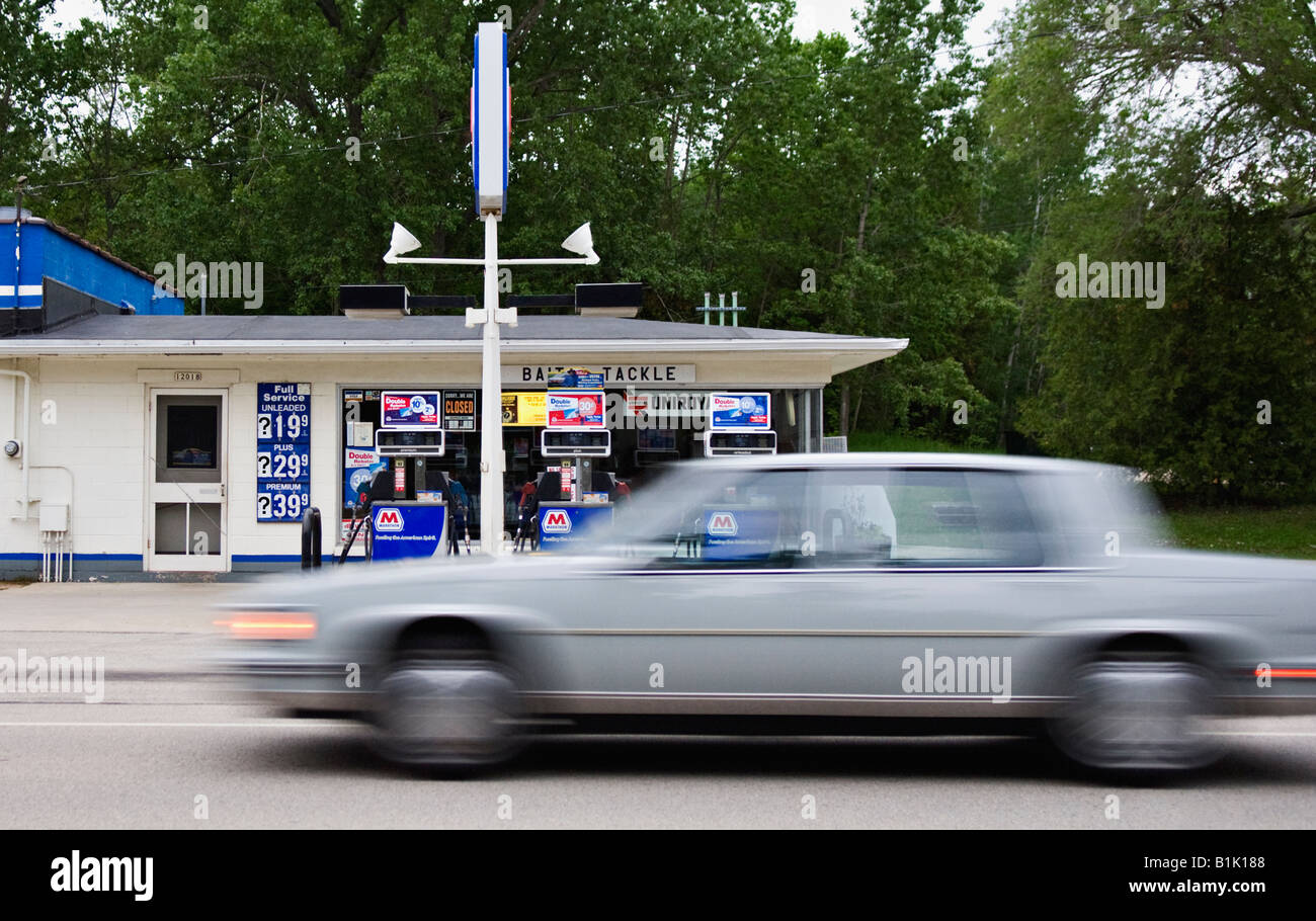 Blurred Car Passing Closed Gas Station with Question Mark for Prices ...