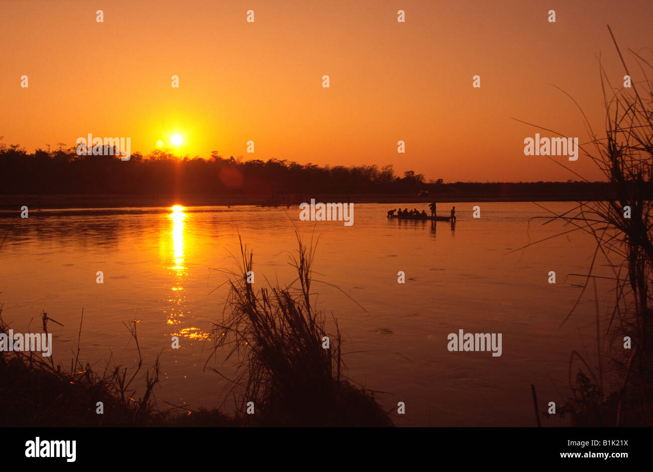 Nepal Chitwan National Park sun setting over Rapti River Stock Photo ...