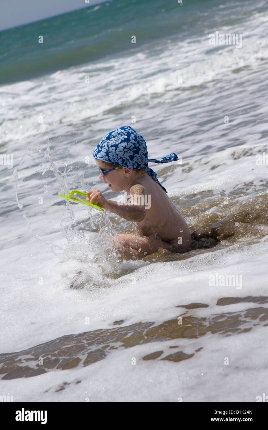 little boy playing on the beach Stock Photo - Alamy