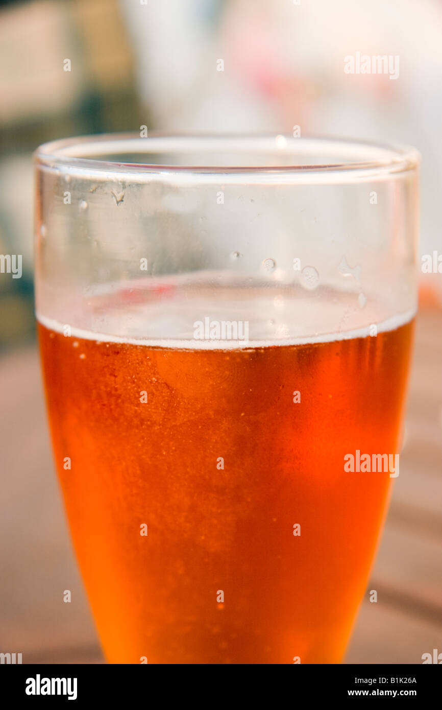 Glass of cold beer in the late afternoon Stock Photo - Alamy