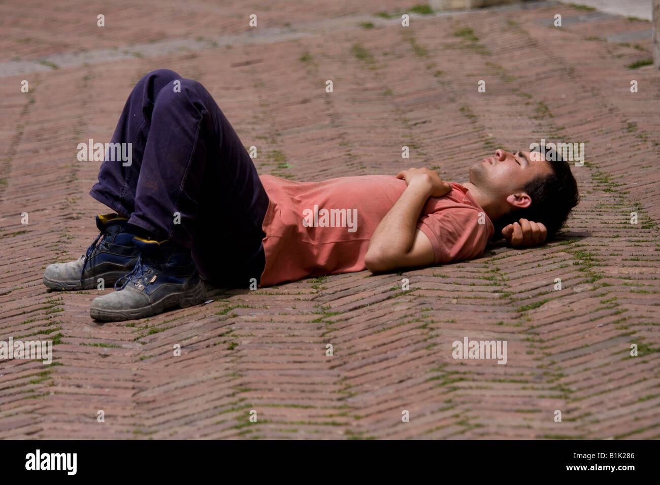 man relaxes lying on floor Stock Photo - Alamy