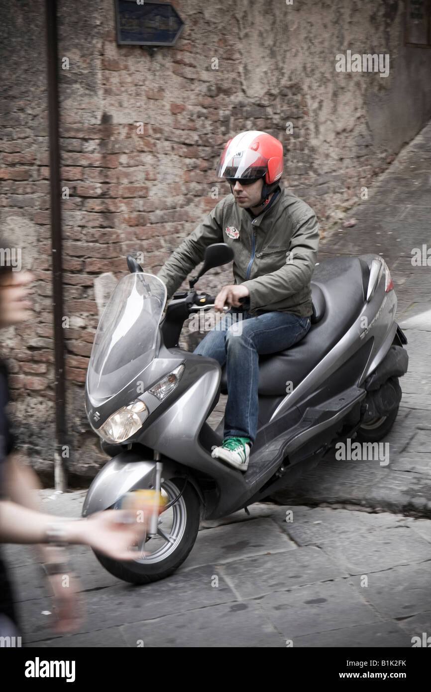 moped driving down steep alley Stock Photo - Alamy