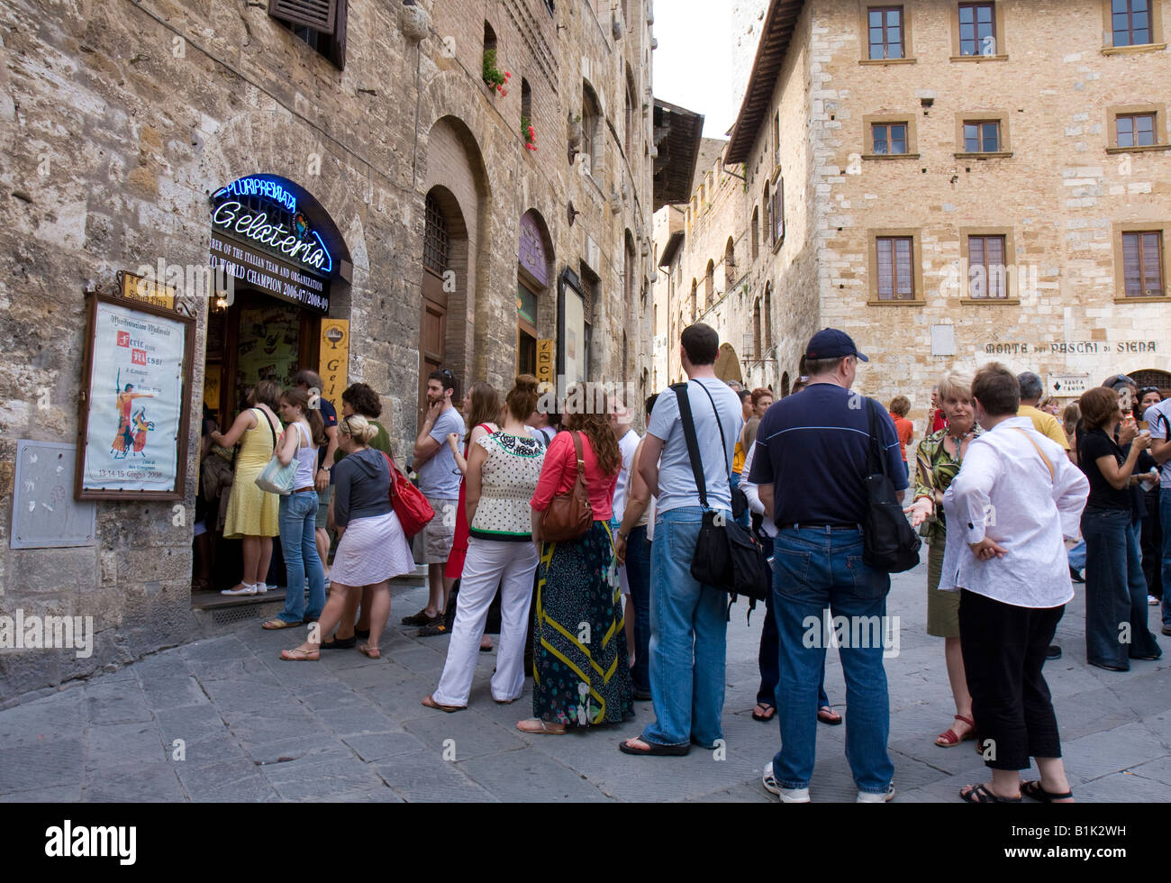 queue in front of ice cream shop Stock Photo - Alamy