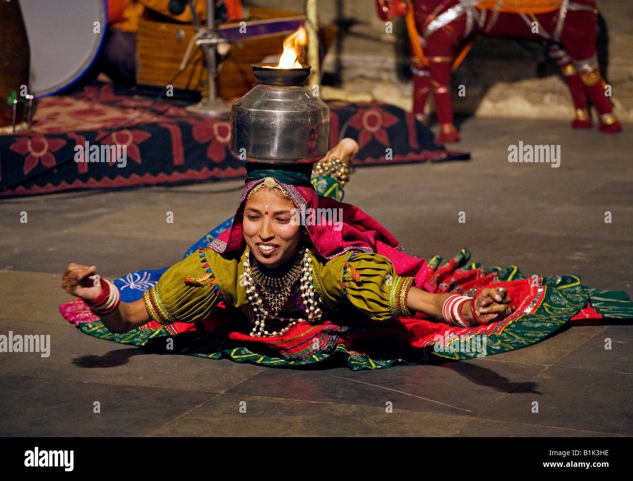 A Rajasthani woman performs traditional DANCE with a flaming pot on her ...