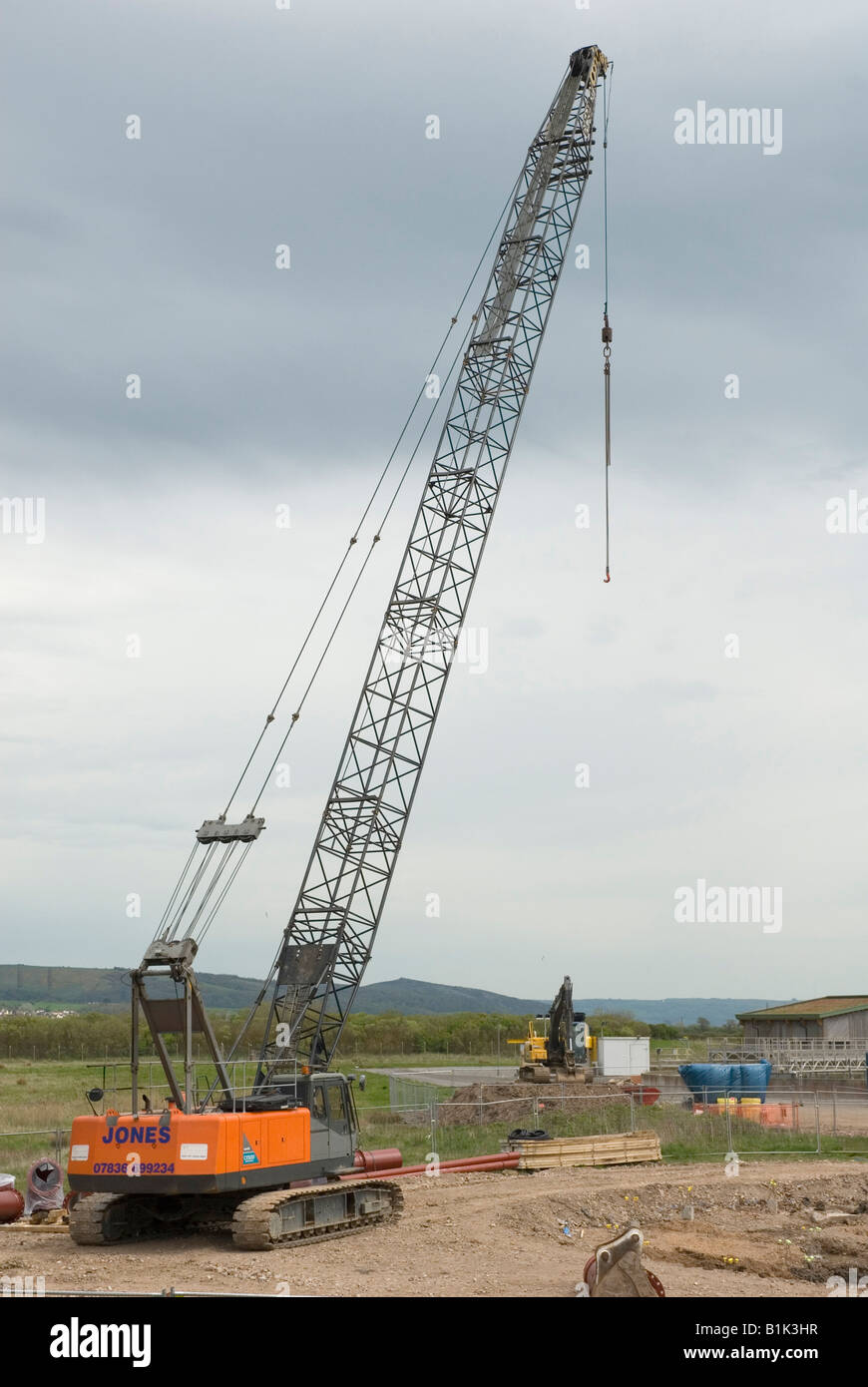 Construction site, building crane, digger, UK Stock Photo - Alamy