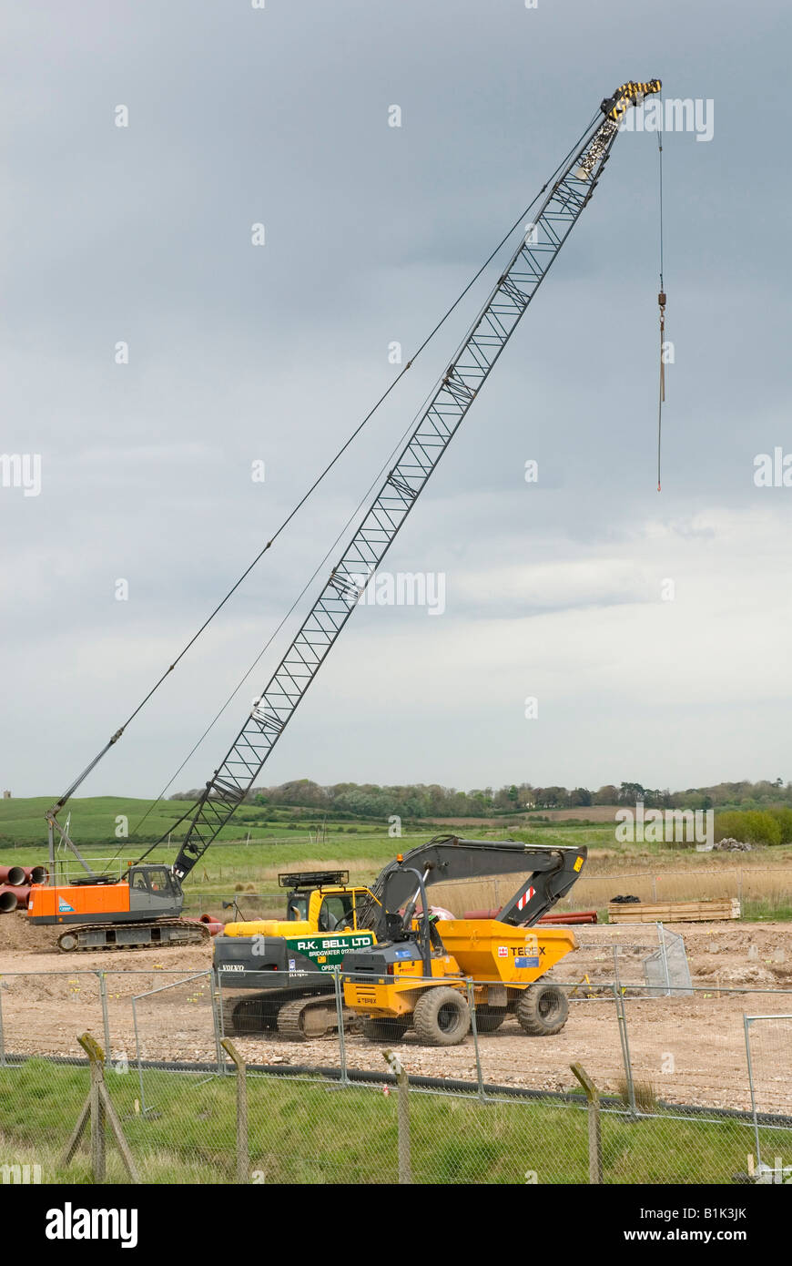 Construction site, building crane, digger, UK Stock Photo - Alamy