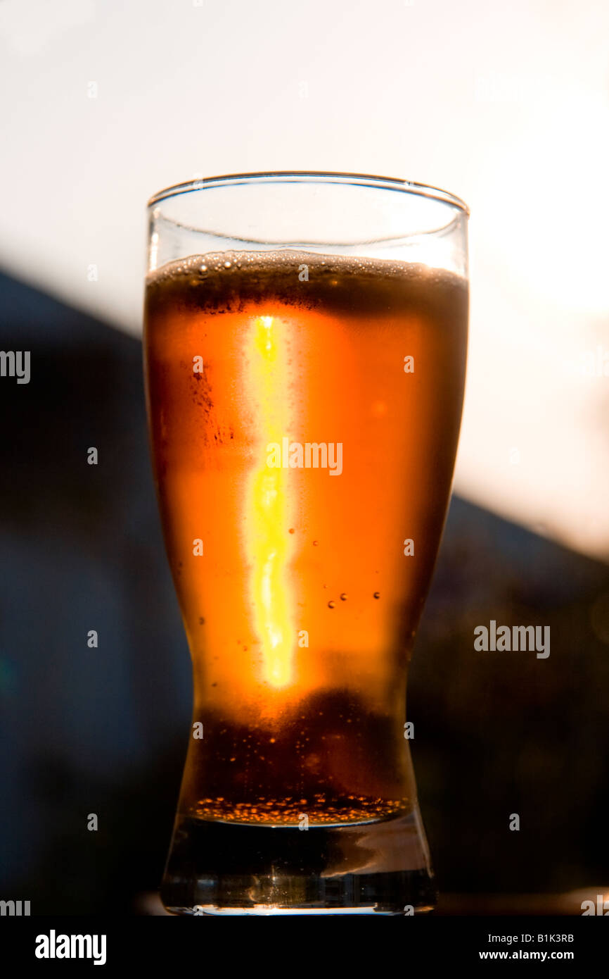 Glass of cold beer in the late afternoon Stock Photo - Alamy