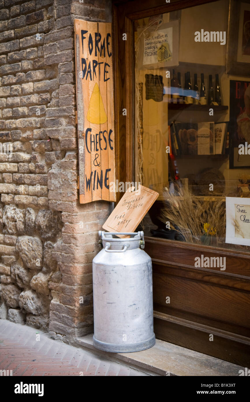 milk churn in front of wine anf cheese shop Stock Photo - Alamy