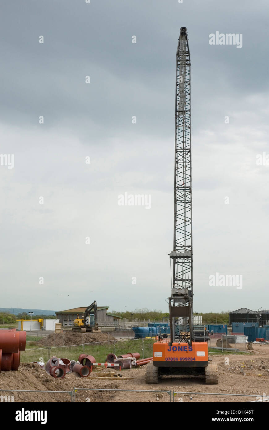 Construction site, building crane, digger, UK Stock Photo - Alamy