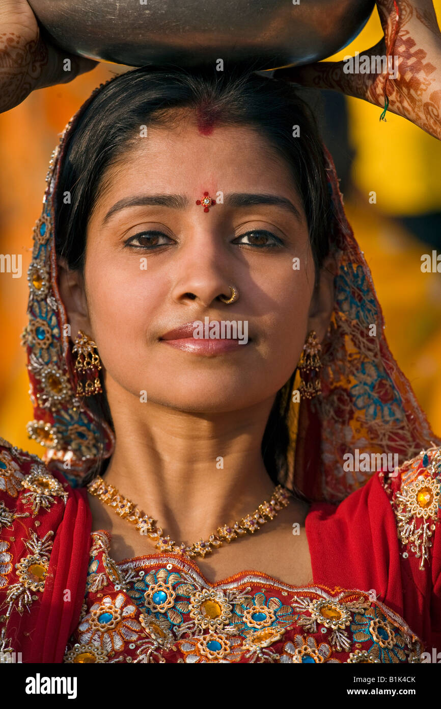 A Rajasthani woman dresses in her finest clothing and jewelry to ...