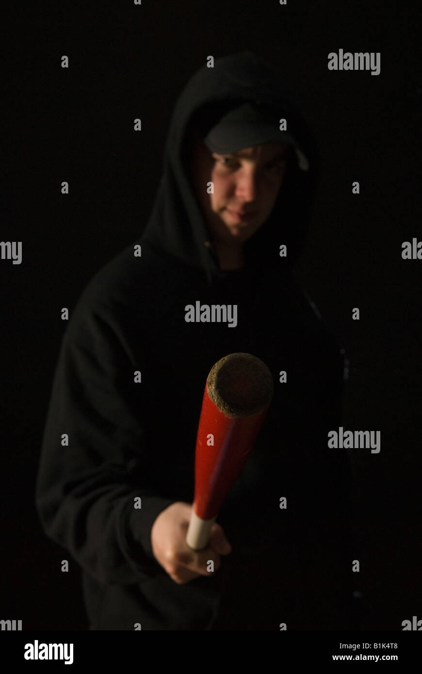 Hoody wearing teenage thug with baseball bat Stock Photo - Alamy