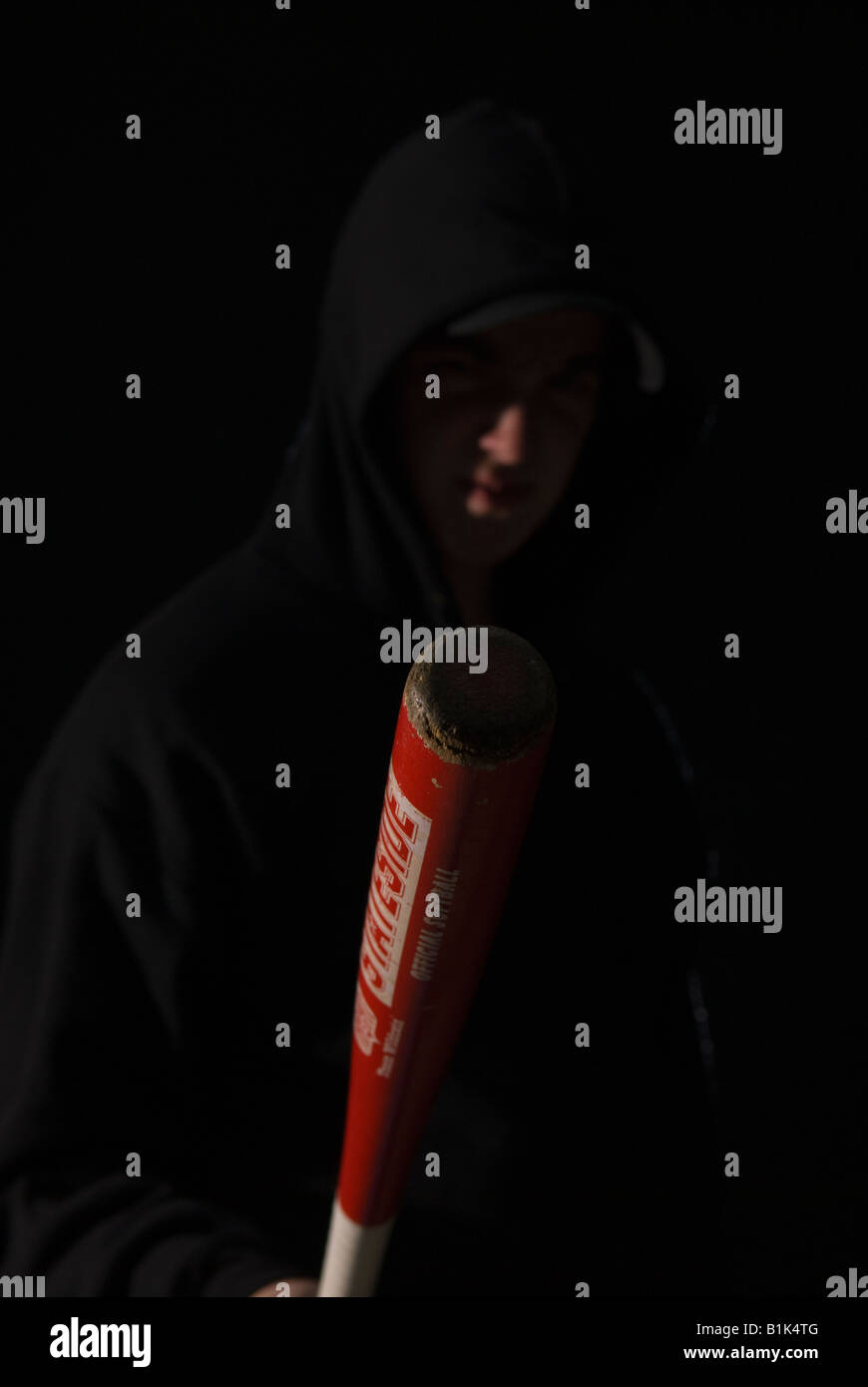 Hoody wearing teenage thug with baseball bat Stock Photo - Alamy
