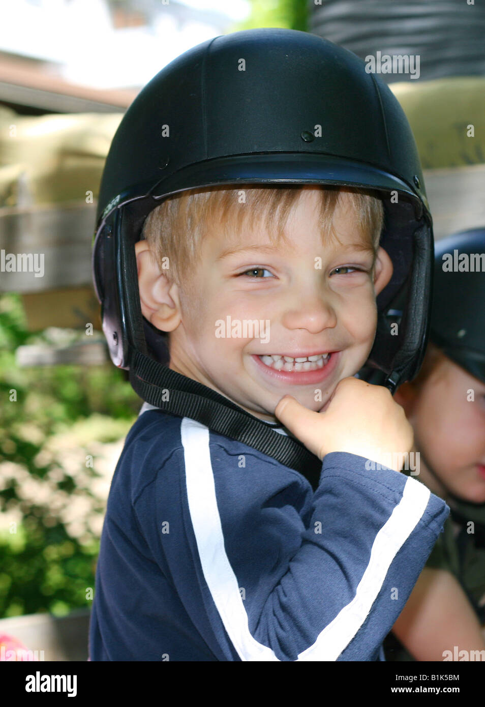 Smiling kid with a helmet on his head Stock Photo - Alamy