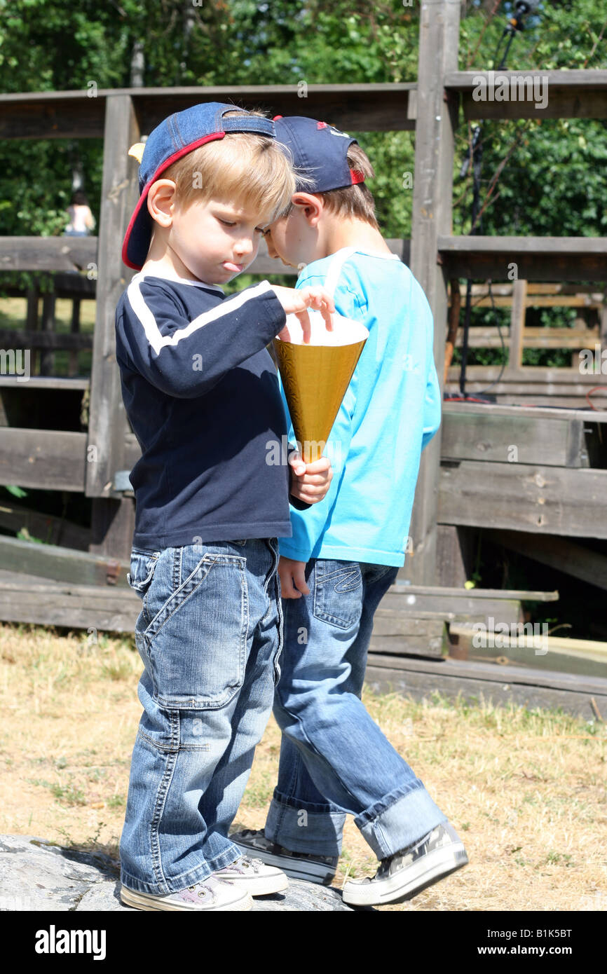 Kid eating popcorn Stock Photo - Alamy
